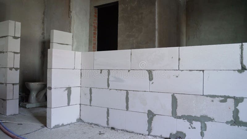 Construction Worker Building a Wall with Concrete Blocks Stock Image ...