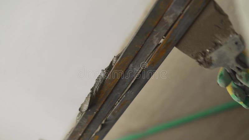 Construction Worker Applying Plaster on Metal Beam Stock Footage ...