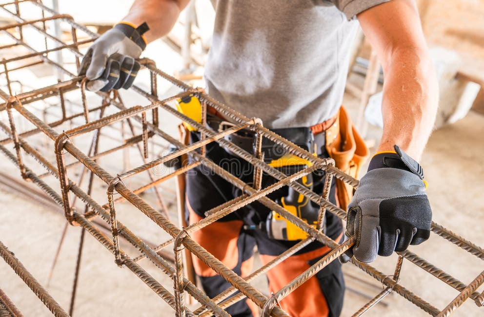 Construction Worker Assembling Rebar Framework in a Building Site ...