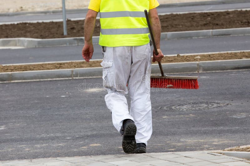 Construction Worker Carrying Sweeping Brush Stock Photo - Image of ...