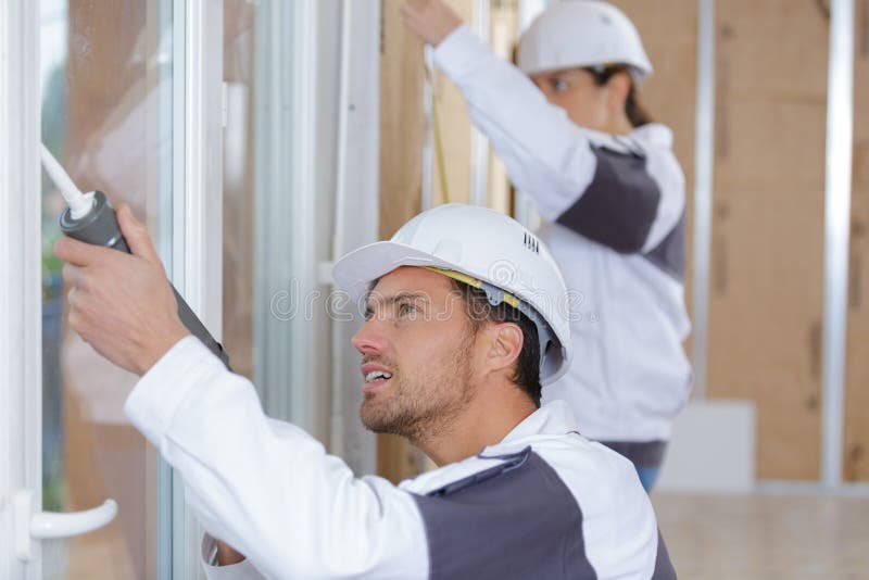 Construction Worker Caulking Window with Silicone Stock Photo - Image of construction, industry ...