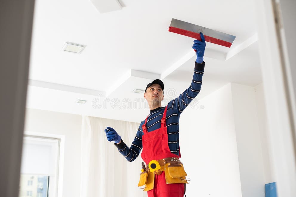 Construction Worker Ceiling Work. Working on Repairs Stock Photo ...