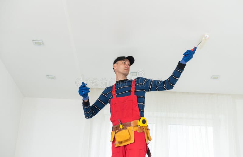 Construction Worker Ceiling Work. Working on Repairs Stock Photo ...