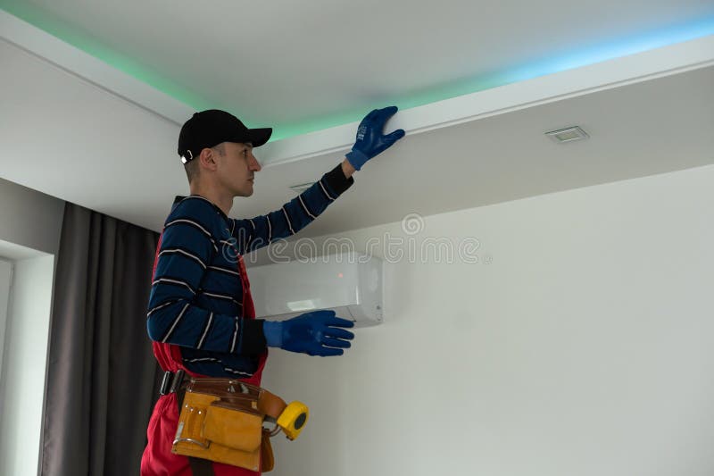 Construction Worker Ceiling Work. Working on Repairs Stock Photo ...