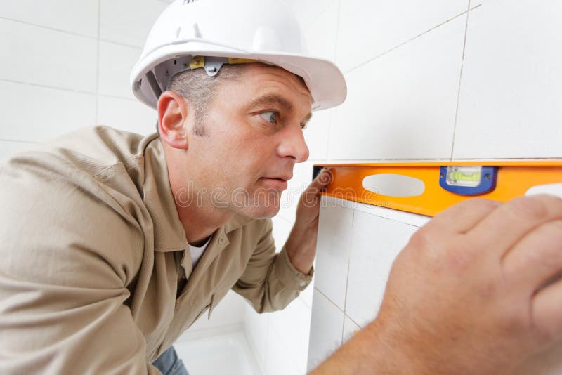 Construction Worker Check Level on Wall Stock Image - Image of ...