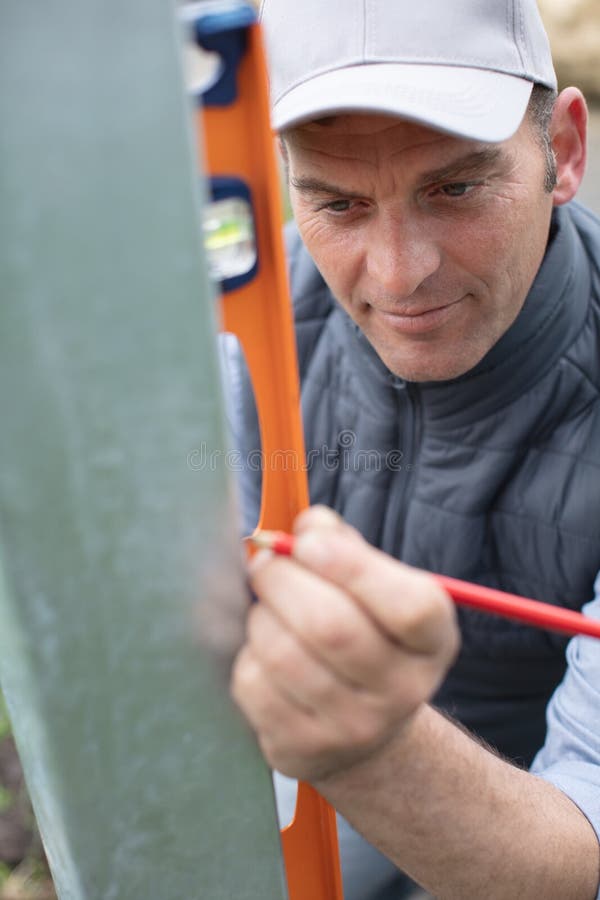 Construction Worker Check Level on Wall Stock Photo - Image of manual ...