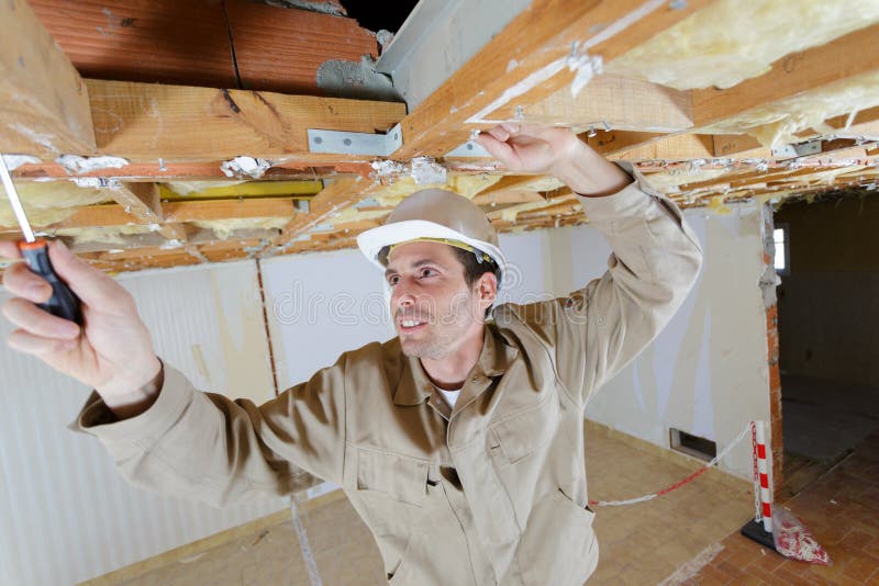 Construction Worker Checking Ceiling Stock Photo - Image of house ...