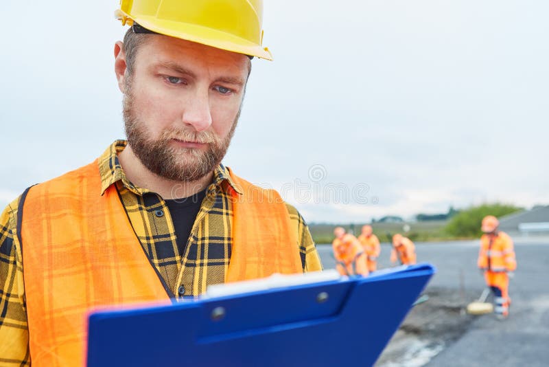 Construction Worker with Checklist Controls Construction Progress Stock ...