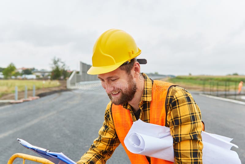 Construction Worker with Checklist and Construction Drawing Stock Image ...