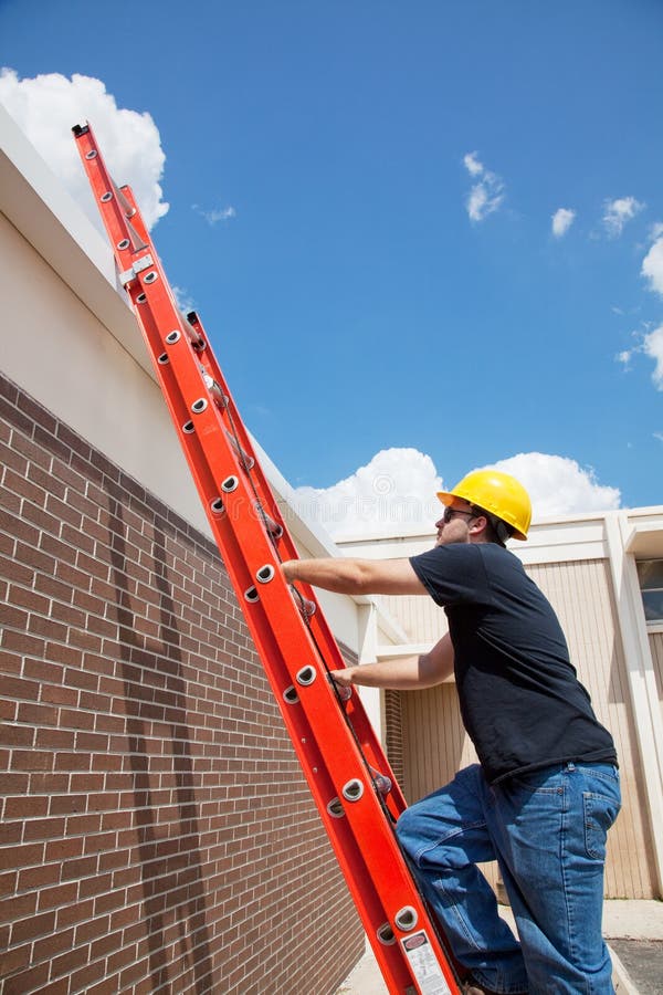 Construction Worker Climbs To Roof Stock Image - Image of outdoors ...