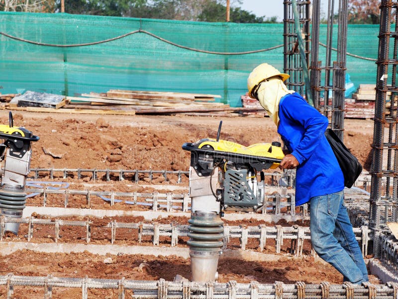 Construction Worker Compacting Soil Stock Photo - Image of industrial ...