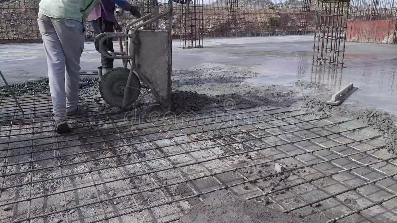 A Construction Worker Concrete Slab Being Cast by Wheelbarrow or ...