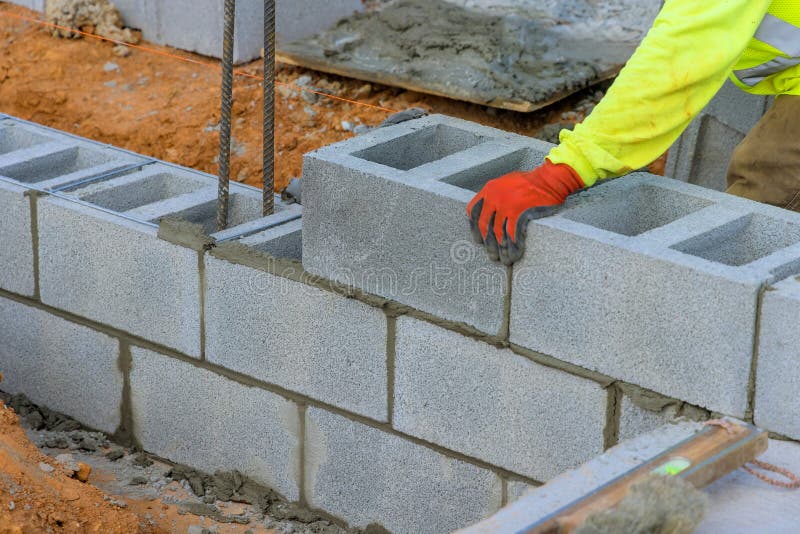 Construction Worker Constructing Concrete Block Wall at Building Site ...
