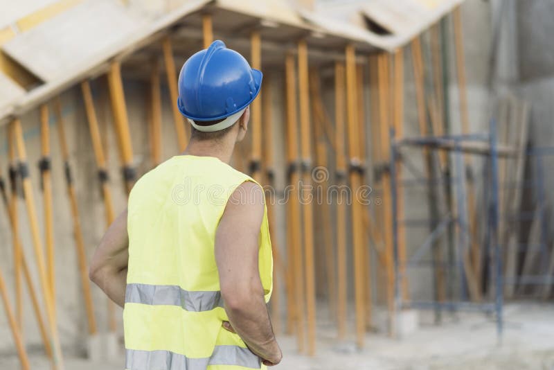 Construction Worker in Construction Site Back Detail, Looking at Stock ...