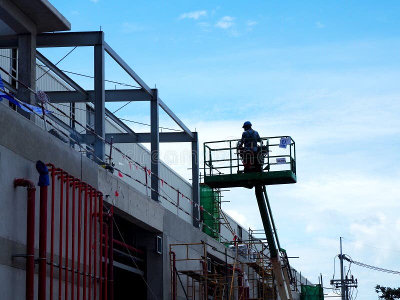 Construction Worker Using Lifting Boom Stock Image - Image of erector ...