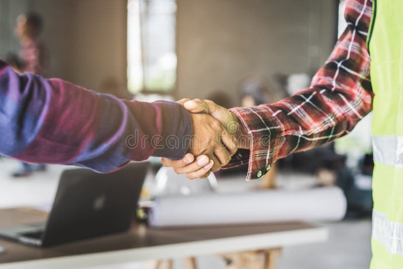Construction Worker and Contractor. Client Shaking Hands with Team ...