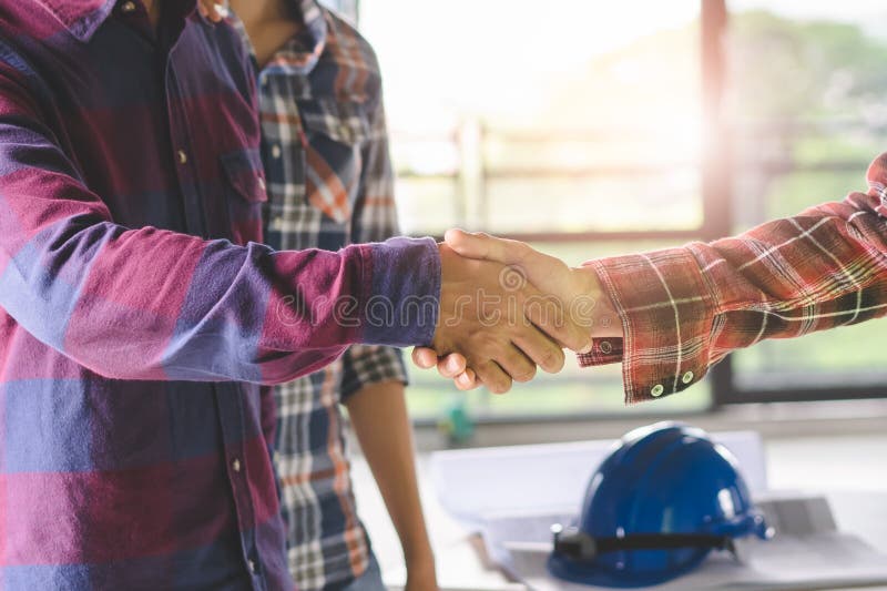 Client Shaking Hands with Team Builder in Renovation Site Stock Photo ...