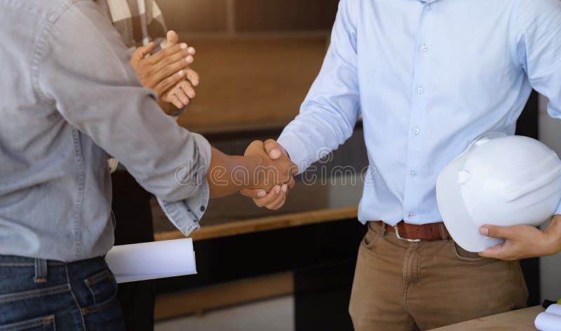 Construction Worker and Contractor. Client Shaking Hands with Team ...