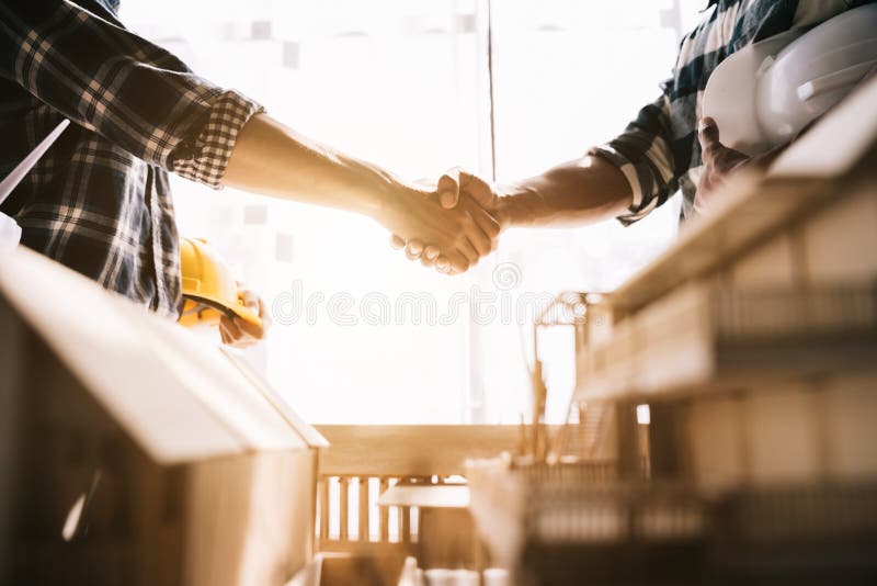 Construction Worker and Contractor. Client Shaking Hands with Team ...