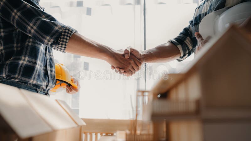 Construction Worker and Contractor. Client Shaking Hands with Team ...