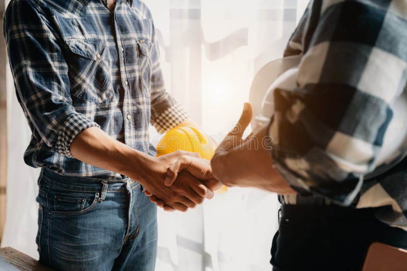 Construction Worker and Contractor. Client Shaking Hands with Team ...