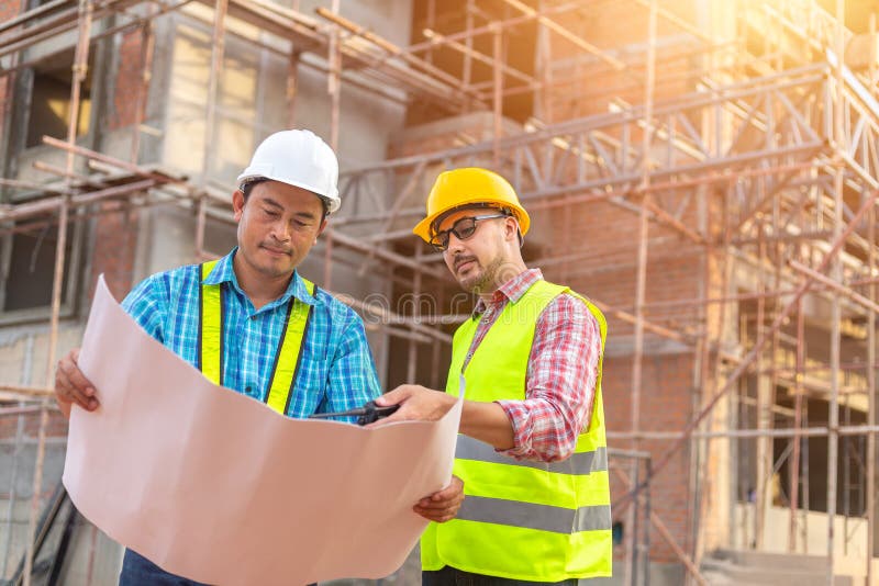 A Construction Worker Control a Pouring Concrete Pump on Construction ...