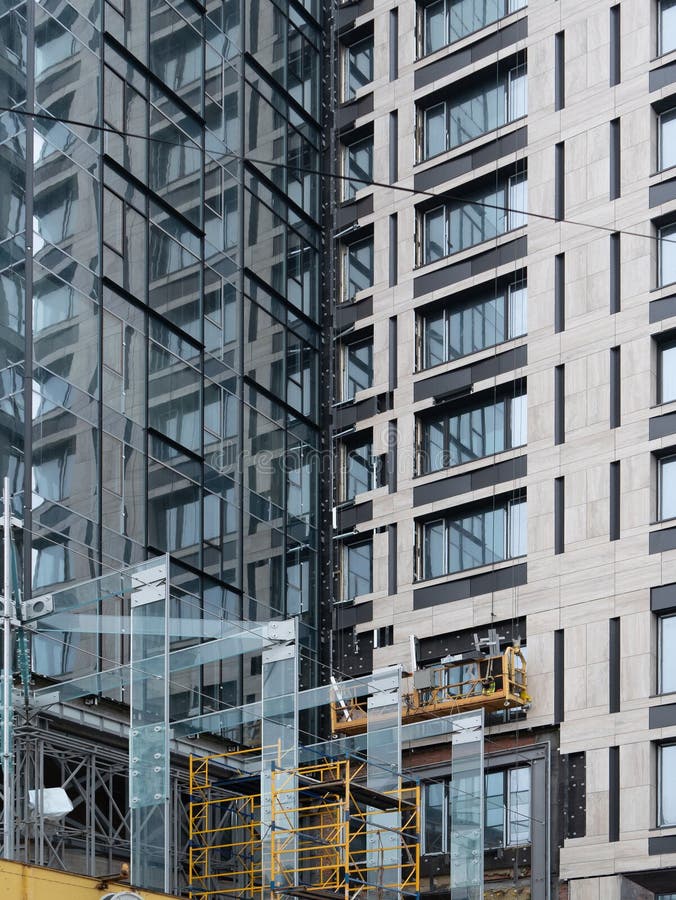 Construction Worker Cradle for Cleaning Windows on Skyscraper Stock ...
