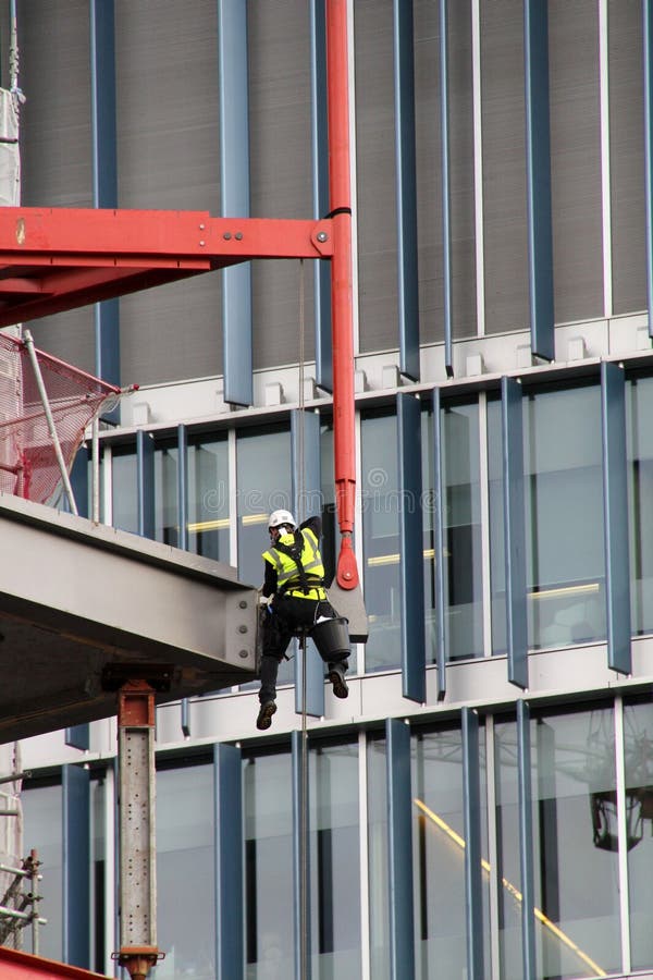 Construction Worker on Crane at Building Site Stock Image - Image of ...