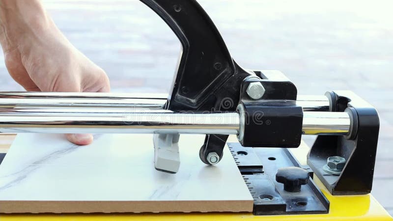 Construction Worker Cuts Ceramic Tile Using Tile Cutting Hand Machine ...