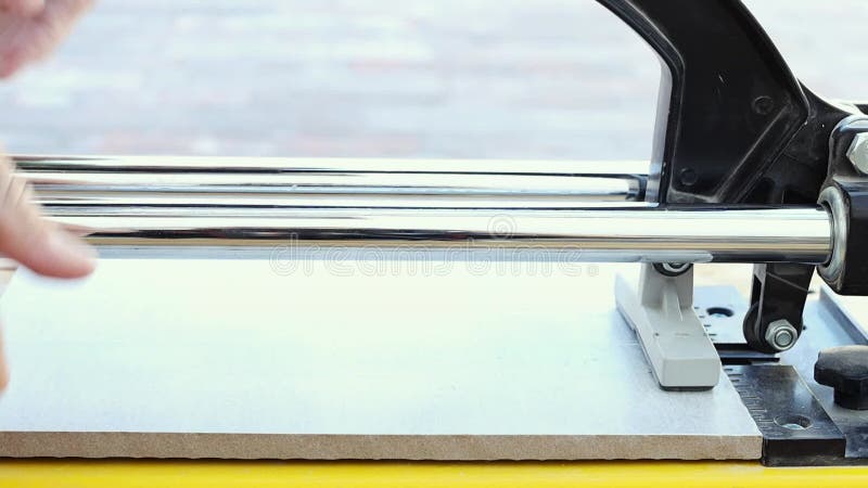 Construction Worker Cuts Ceramic Tile Using Tile Cutting Hand Machine ...