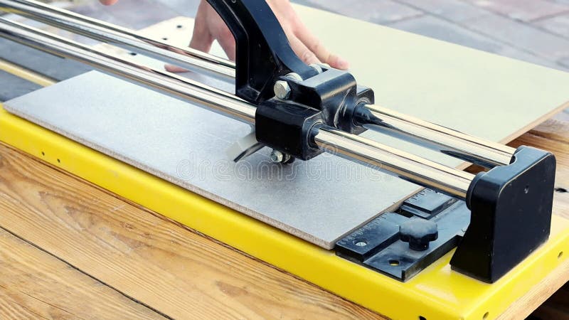 Construction Worker Cuts Ceramic Tile Using Tile Cutting Hand Machine ...