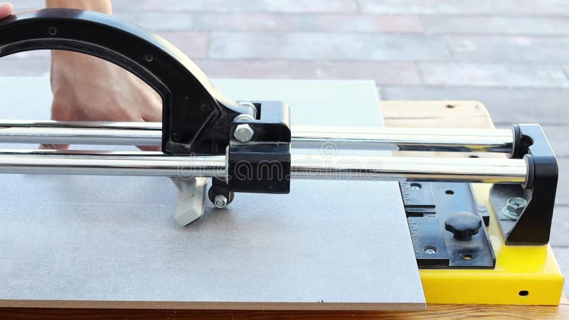 Construction Worker Cuts Ceramic Tile Using Tile Cutting Hand Machine ...