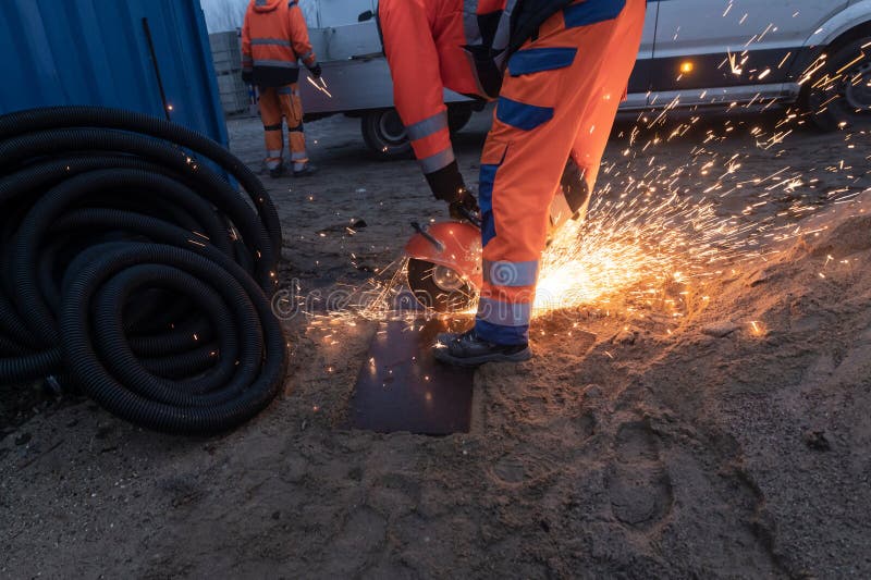 A Construction Worker with an Angle Grinder Stock Photo - Image of ...