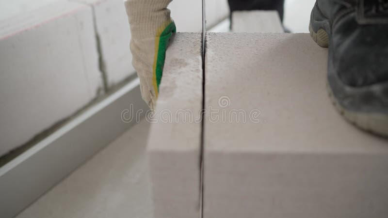 Construction Worker Cutting Aerated Concrete Block with Hand Saw Stock ...