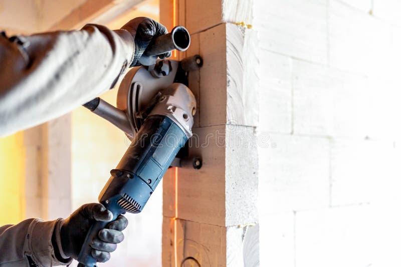 Construction Worker Cutting Aerated Concrete Blocks with Angle Grinder ...
