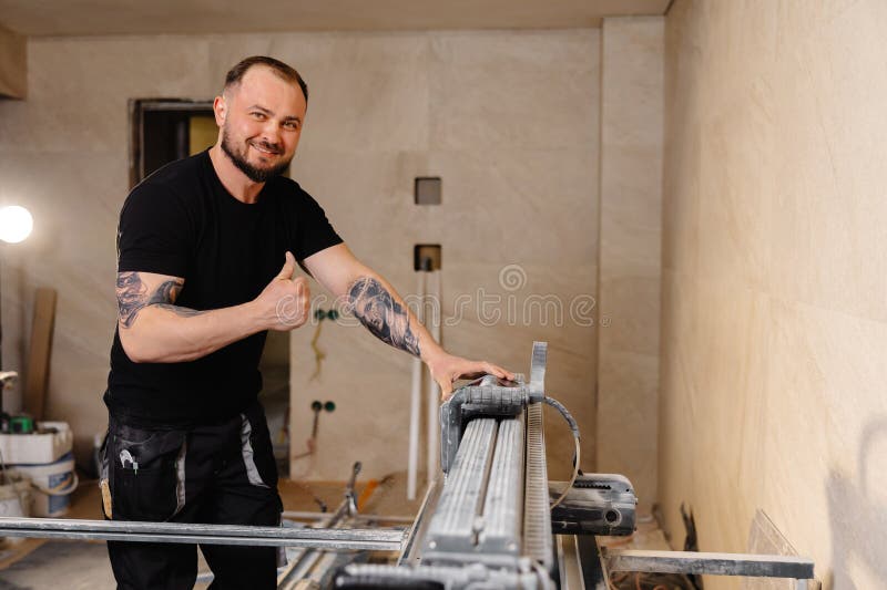 Construction Worker Cutting Ceramic Tiles Using Professional Machine ...