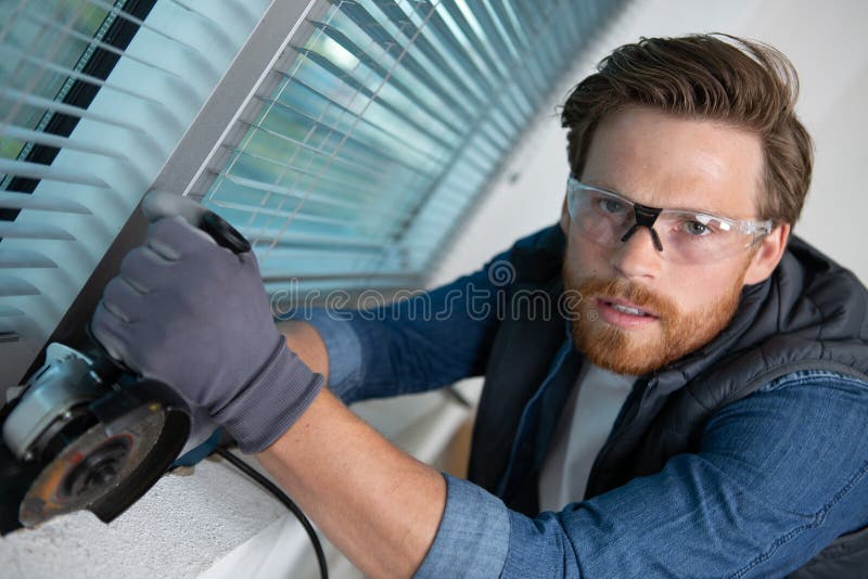 Construction Worker Cutting Concrete Wall by Using Handheld Circular ...