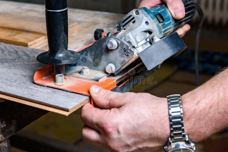 Construction Worker Cutting Laminate Using Angle Grinder with Stand for ...