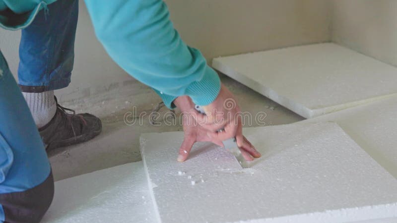 Construction Worker Cutting Styrofoam Panels for Floor Insulation Stock ...