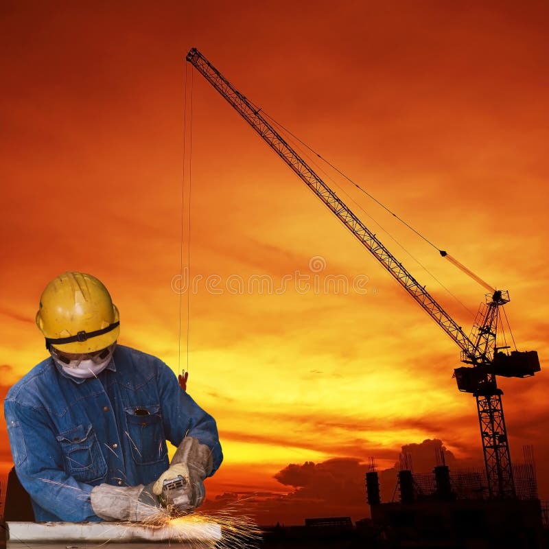 Construction Worker Cutting Metal with a Construction Background Stock ...