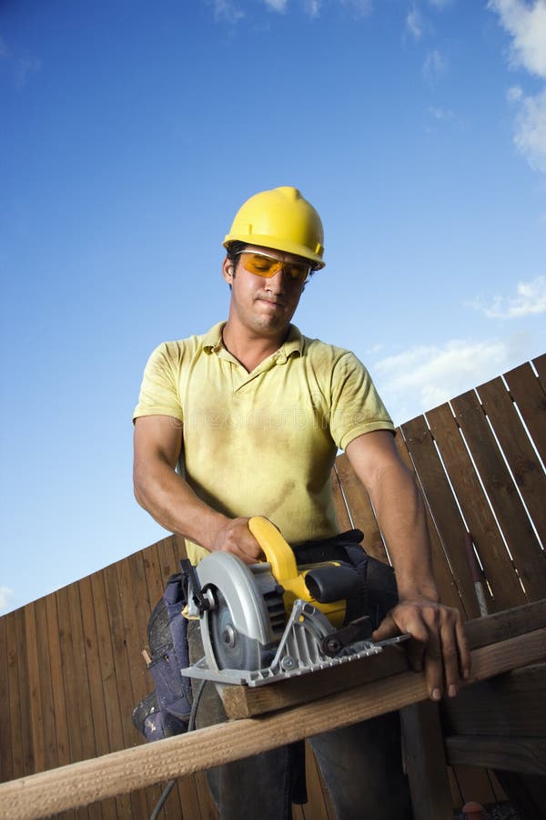 Construction Worker Cutting Wood Stock Image - Image of clothing ...