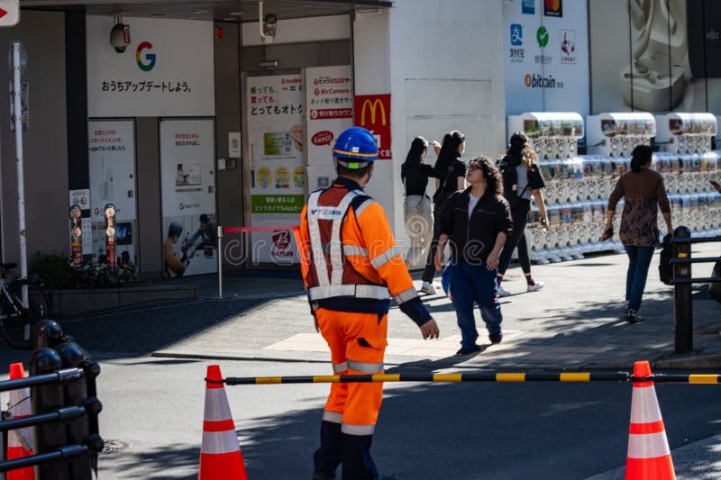 Tokyo, Japan, 26 October 2023: Construction Worker Directing Traffic ...