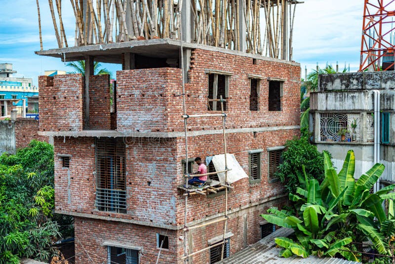 Construction Worker Doing His Job on an Incomplete Building in a Rural ...