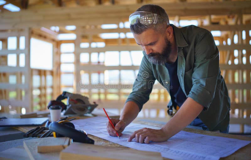 Construction Worker Drawing and Checking Blueprints, Diy Eco-friendly ...