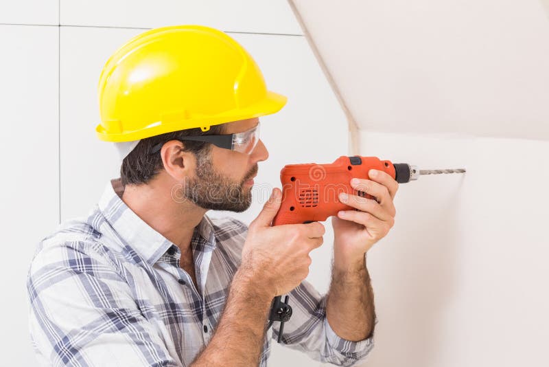 Construction Worker Drilling Hole in Wall Stock Photo - Image of ...