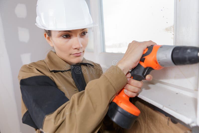 Construction Worker Drilling Window Stock Photo - Image of equipment ...