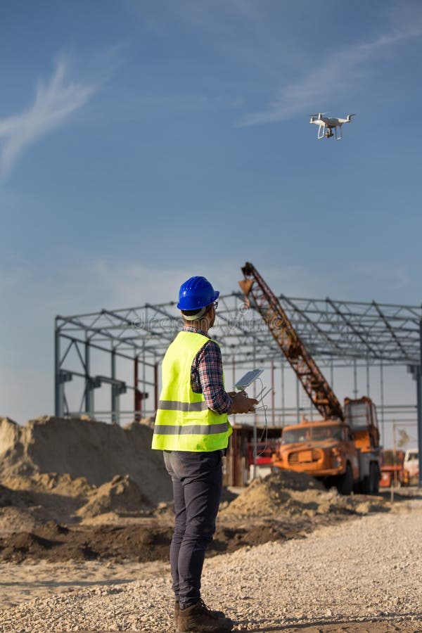 Construction Worker with Drone at Building Site Stock Image - Image of ...