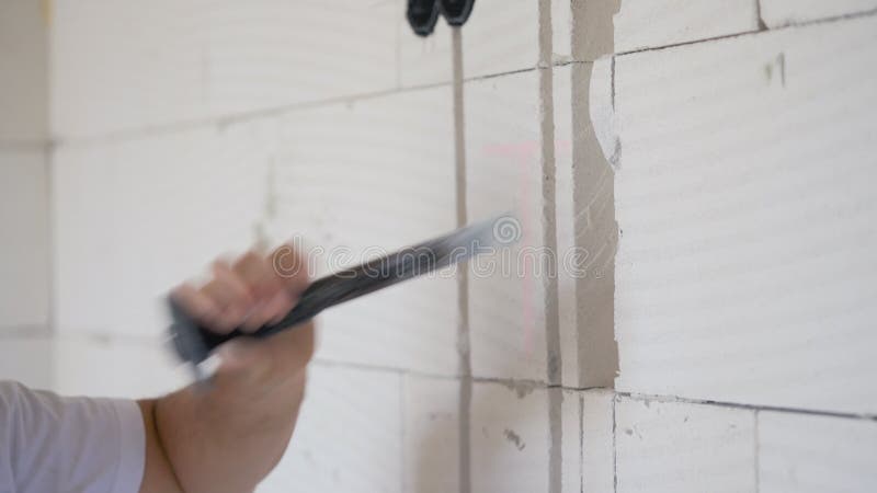 Construction Worker Expanding Electric Cable Chase Grooves with Wall ...