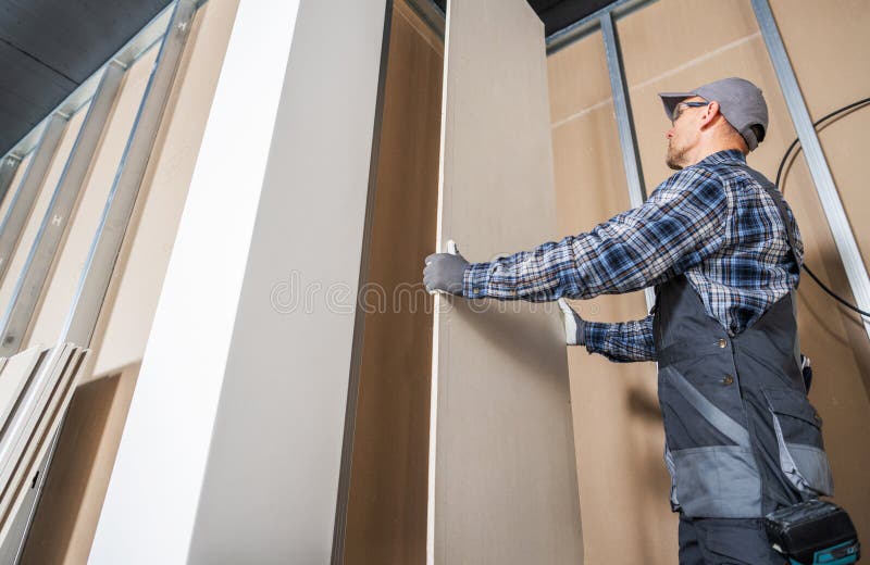 Construction Worker Fitting Piece of a Drywall Stock Photo - Image of ...