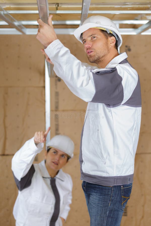 Construction Worker Fixing Ceiling Stock Image - Image of interior ...